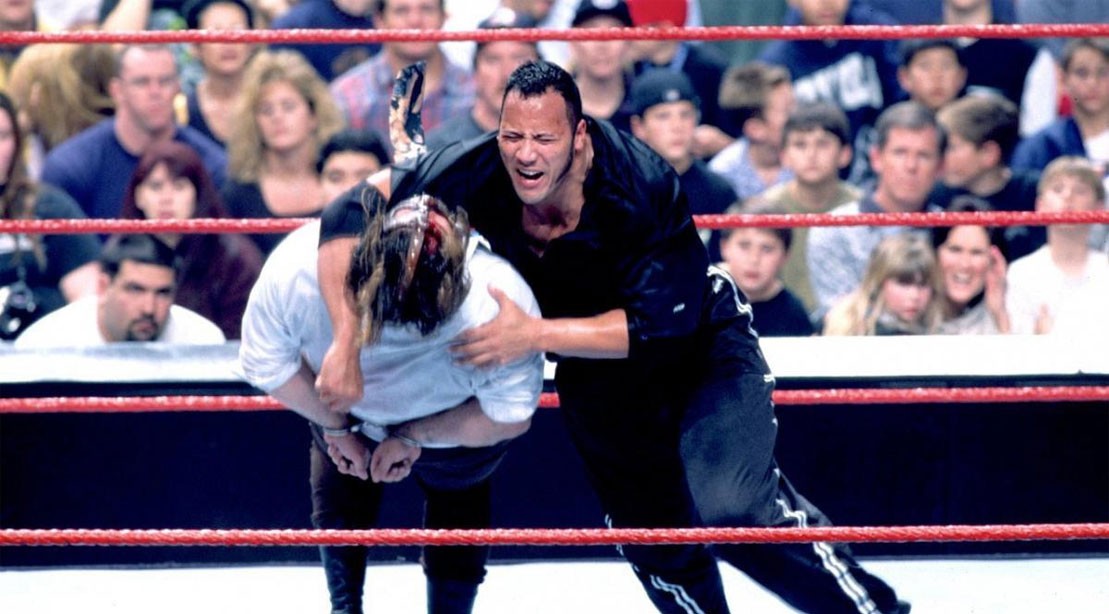 Dwayne 'The Rock' Johnson's Greatest WWE Moments | Muscle & Fitness